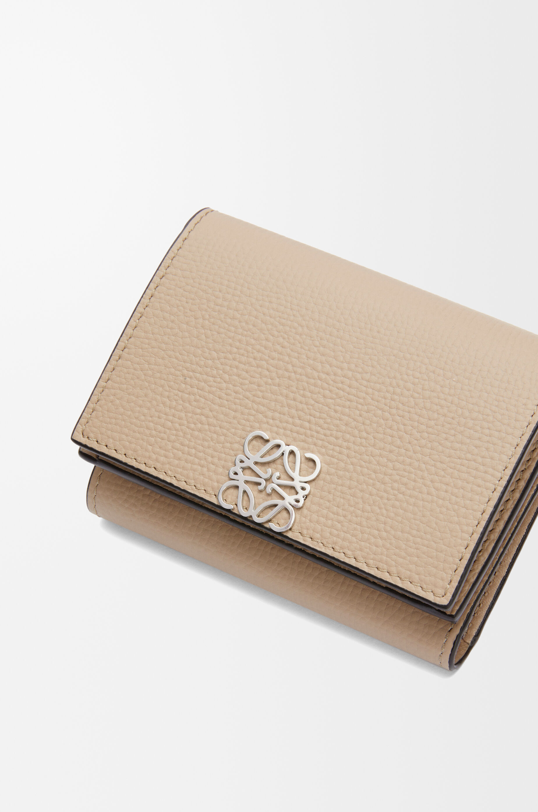 Anagram trifold wallet in pebble grain calfskin Sand - LOEWE